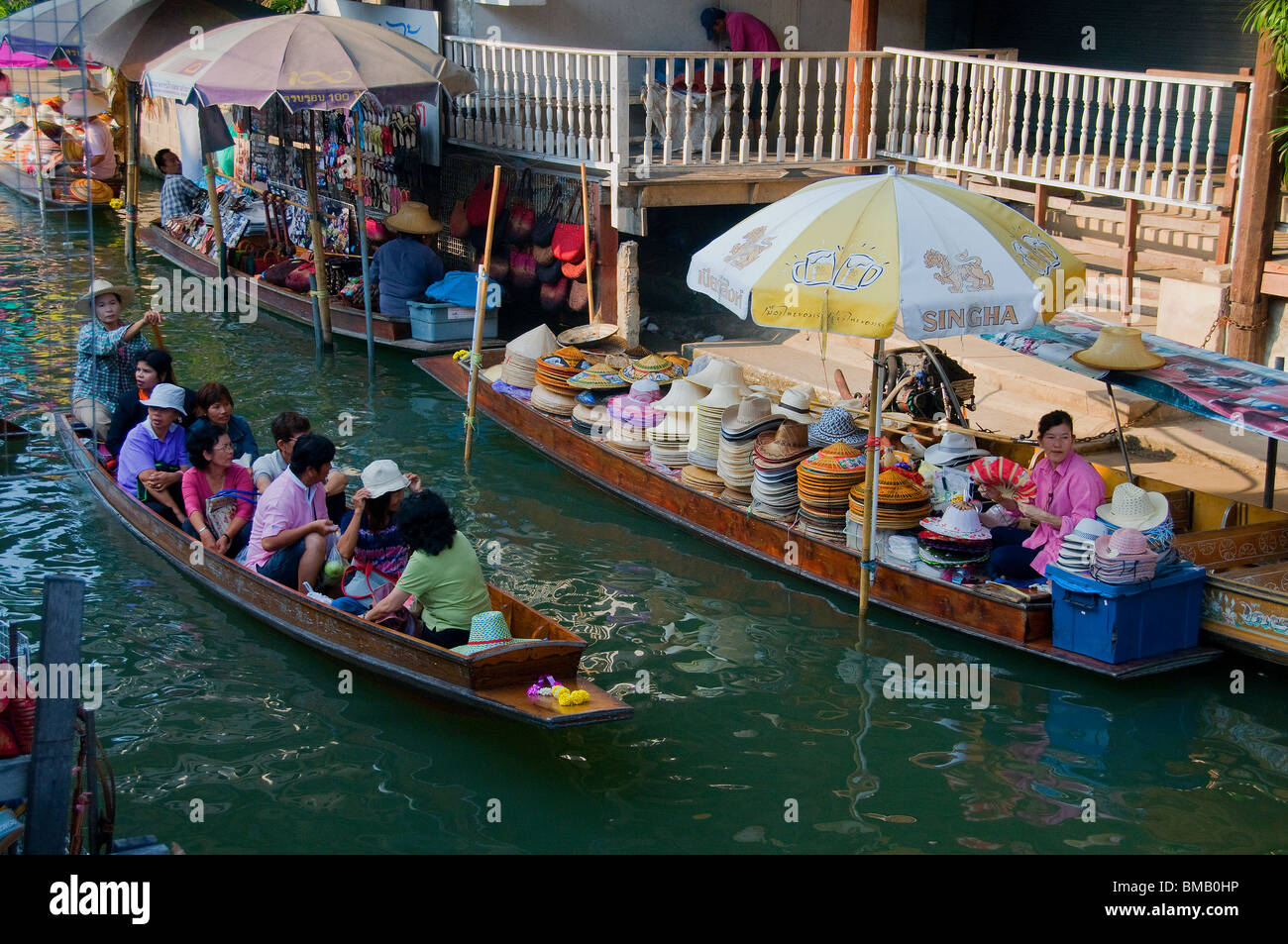 Thai boat vendors at the Damnoen Saduak Floating Market offer many ...