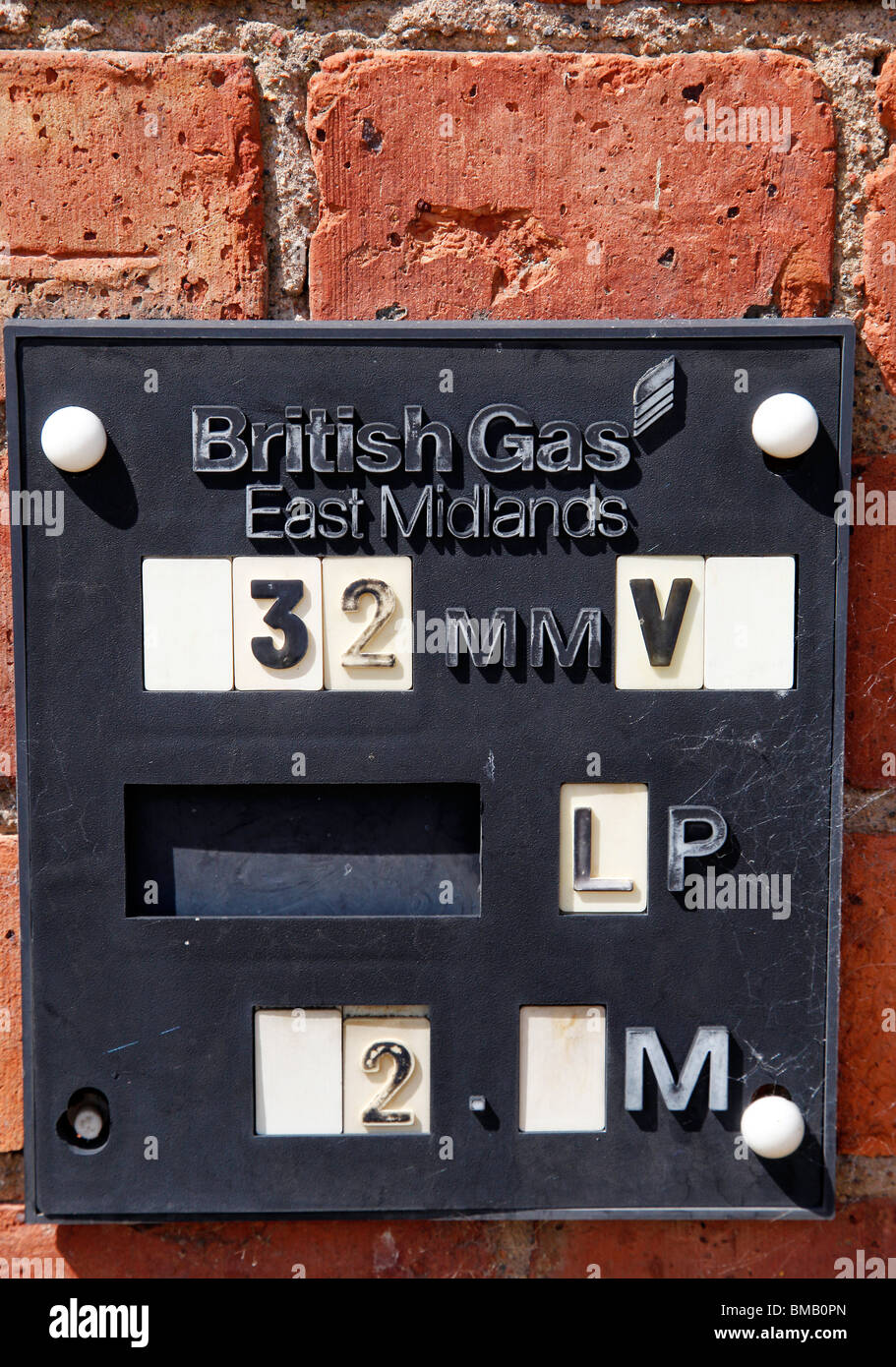 A wall mounted sign indicating gas supply line Stock Photo - Alamy