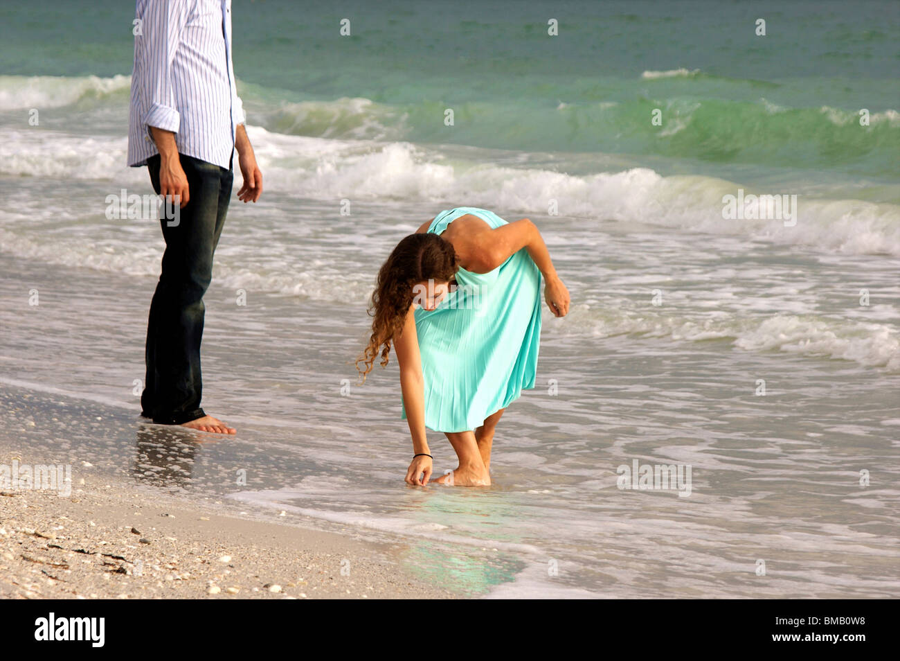 Picking Up Shells On Beach High Resolution Stock Photography and Images ...