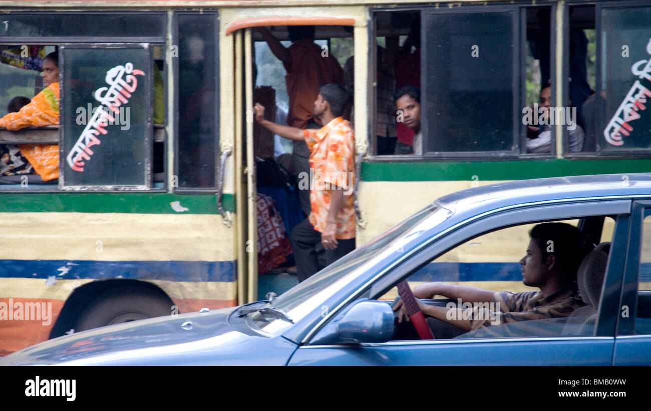 Street scene ; car and local bus on road traffic in Dhaka ; Bangladesh ...