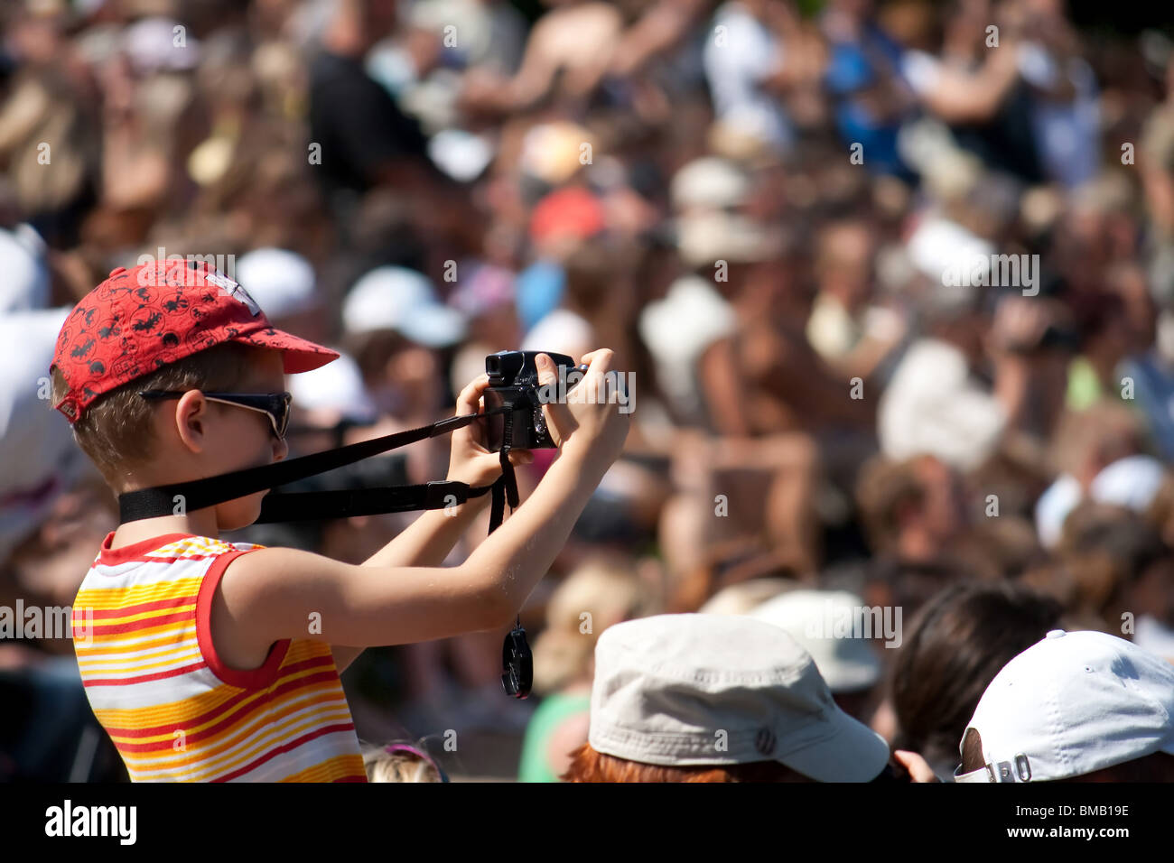 child with photo camera, fest, crowd, people Stock Photo - Alamy