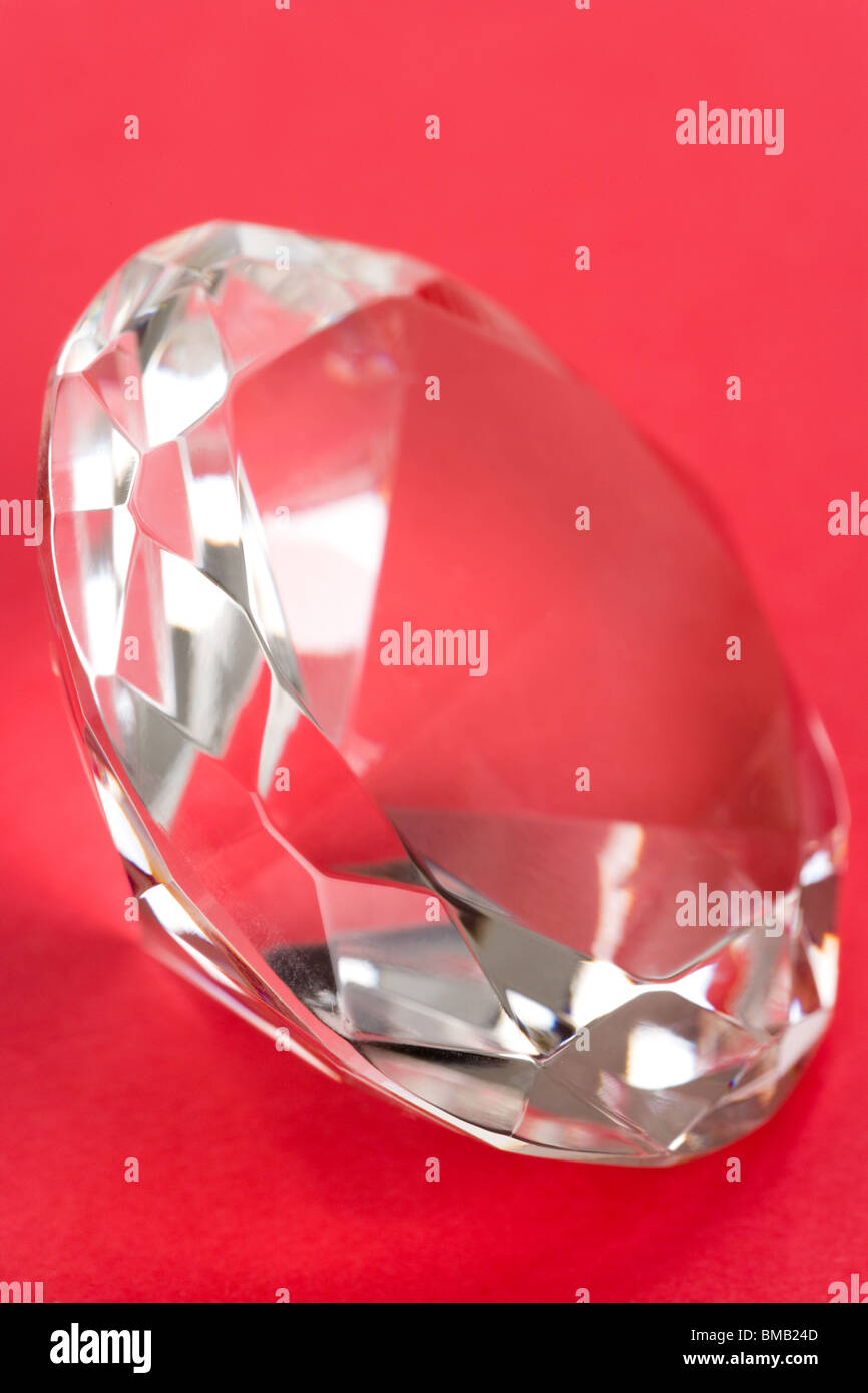Diamond close up shot with red background Stock Photo - Alamy
