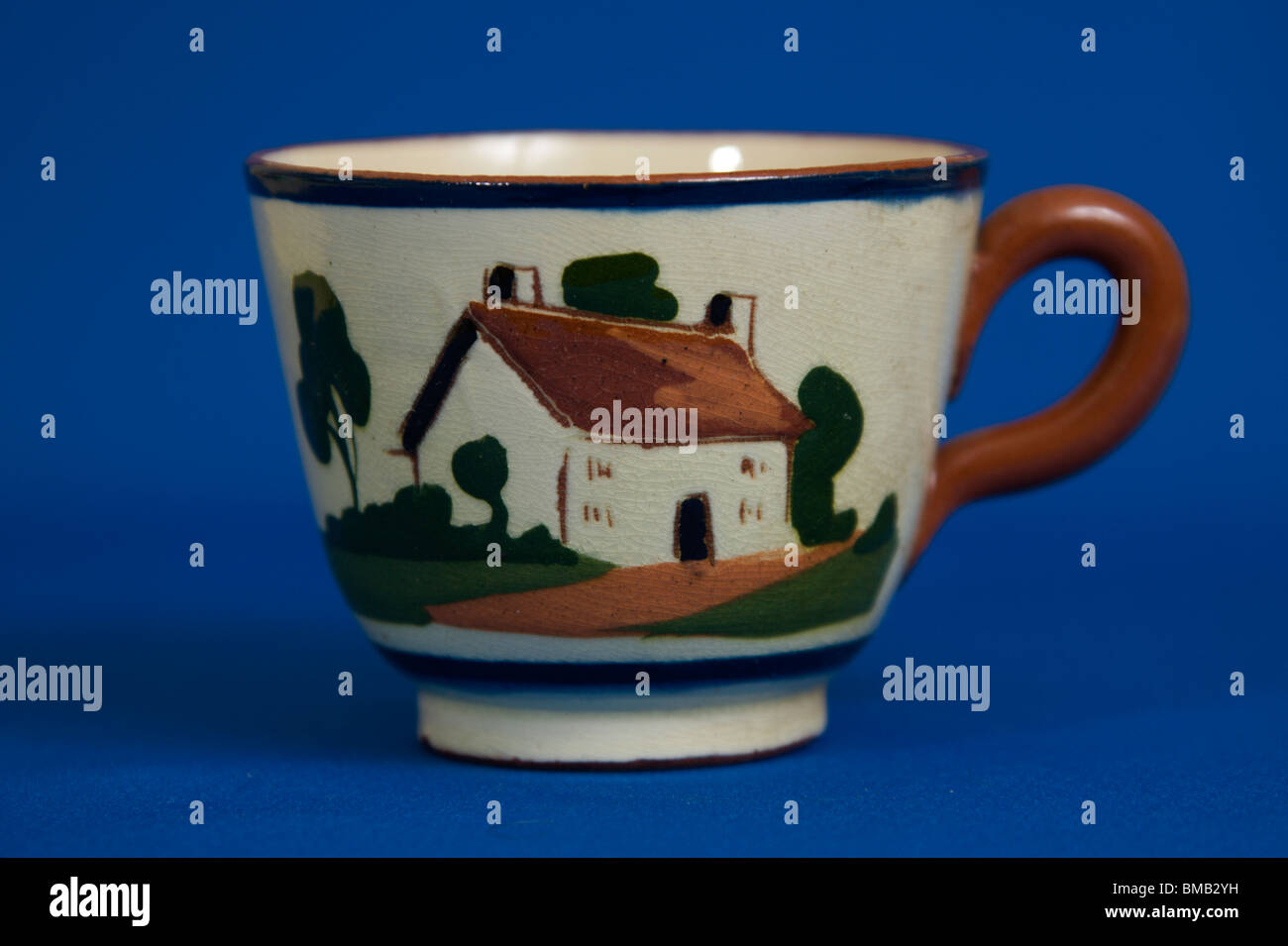 mottoware Devon ware cup Stock Photo - Alamy