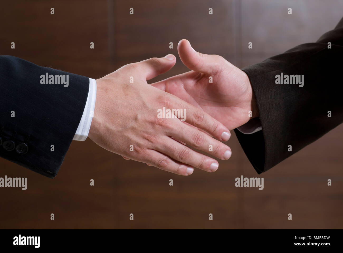 Business men handshake Stock Photo - Alamy