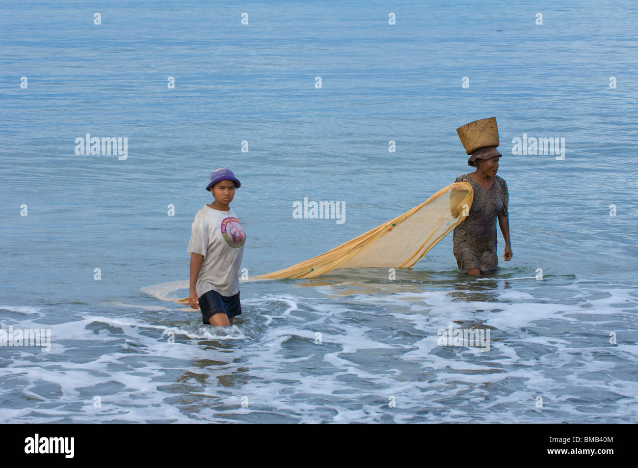 Women fishing with a net in Antongil Bay, Maroantsetra, Madagascar ...