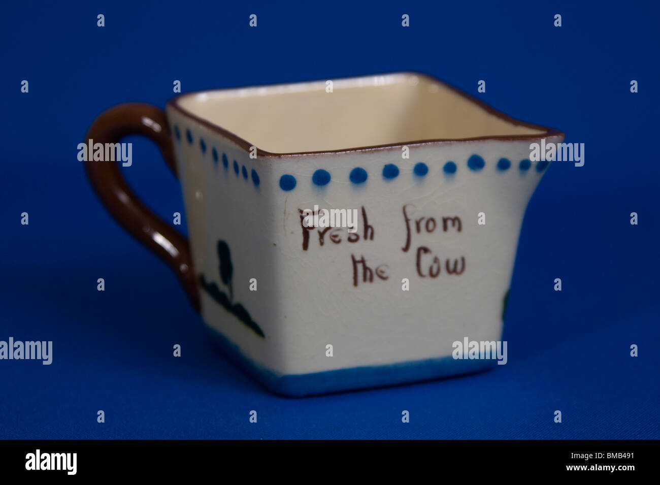 mottoware Devon ware small milk jug Stock Photo - Alamy