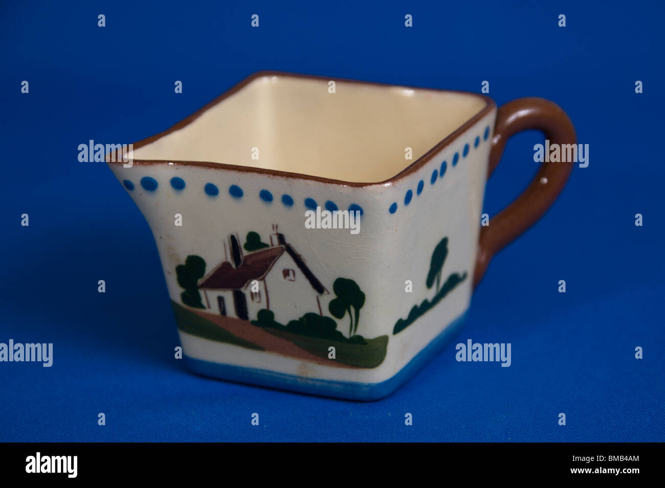 mottoware Devon ware small milk jug Stock Photo - Alamy