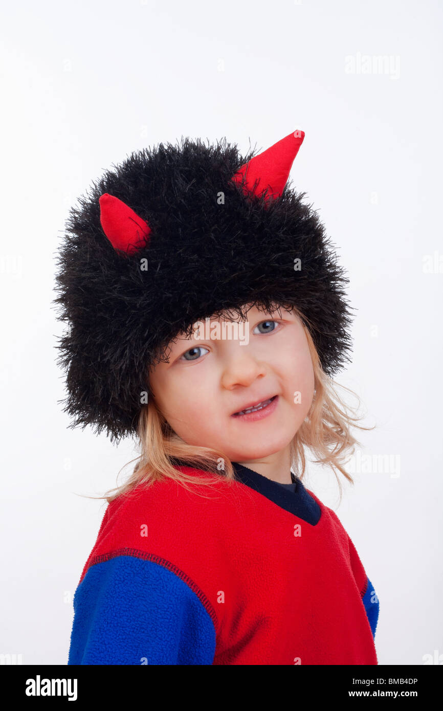 boy wearing cap with horns - isolated on white Stock Photo - Alamy