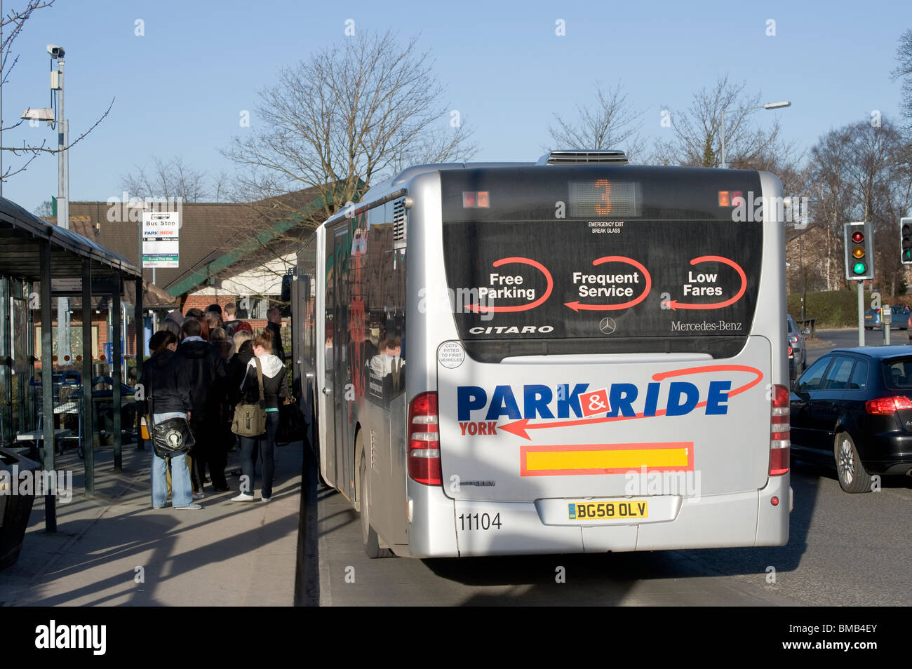 Passengers boarding a park and ride bus at a bus stop in England Stock ...