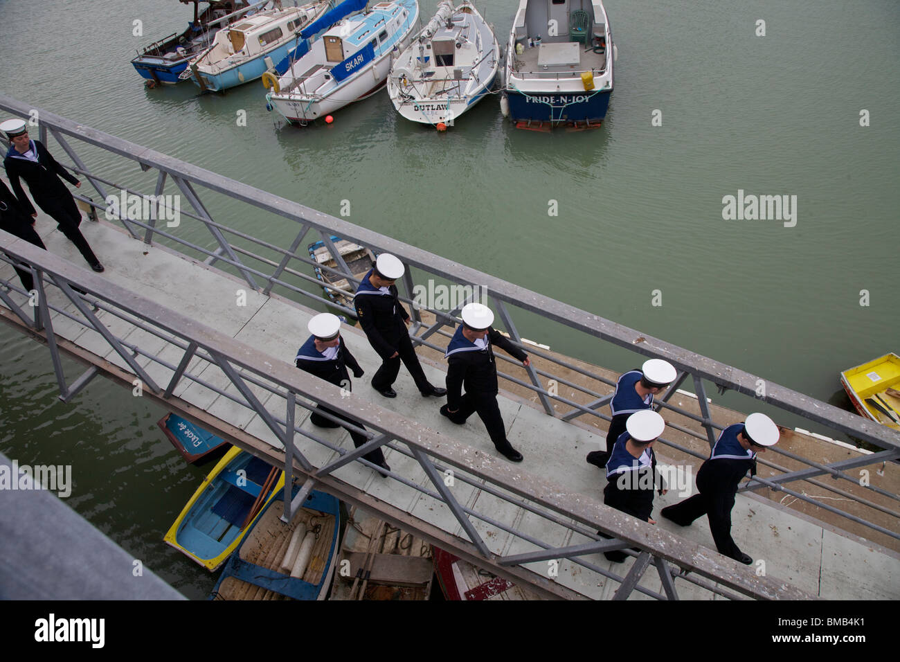 Naval Cadets walking along the jetty to their allocated boats for their ...