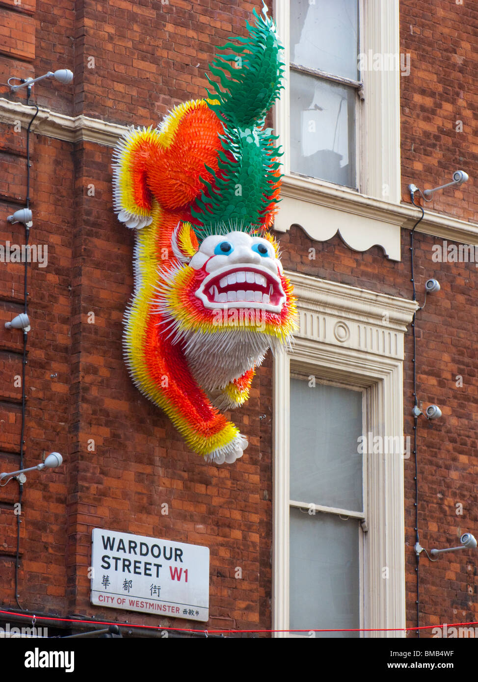 Chinese New Year dragon above street sign for Wardour Street in London ...