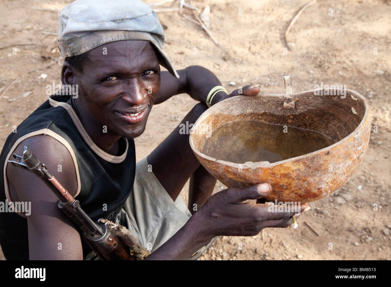 Tsemai man drinking from a gourd, southern Ethiopia Stock Photo - Alamy