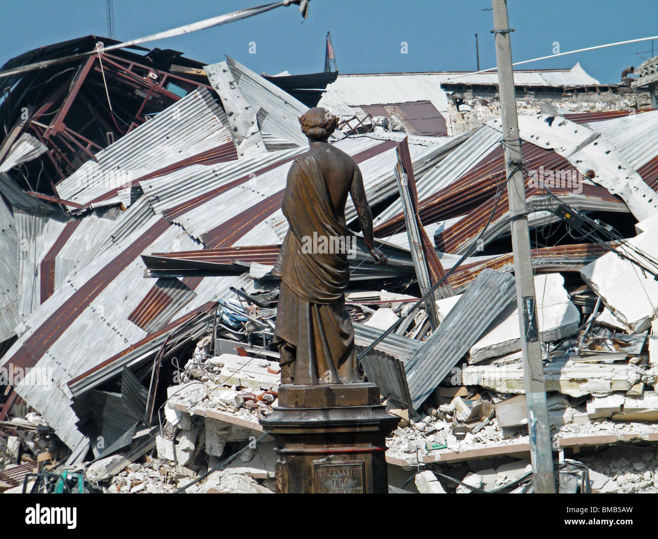 A statue stands amid the rubble of central Port au prince after the ...