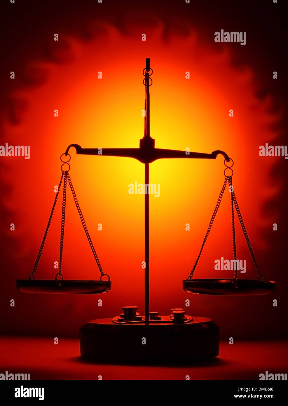 Scales on red light background Stock Photo - Alamy