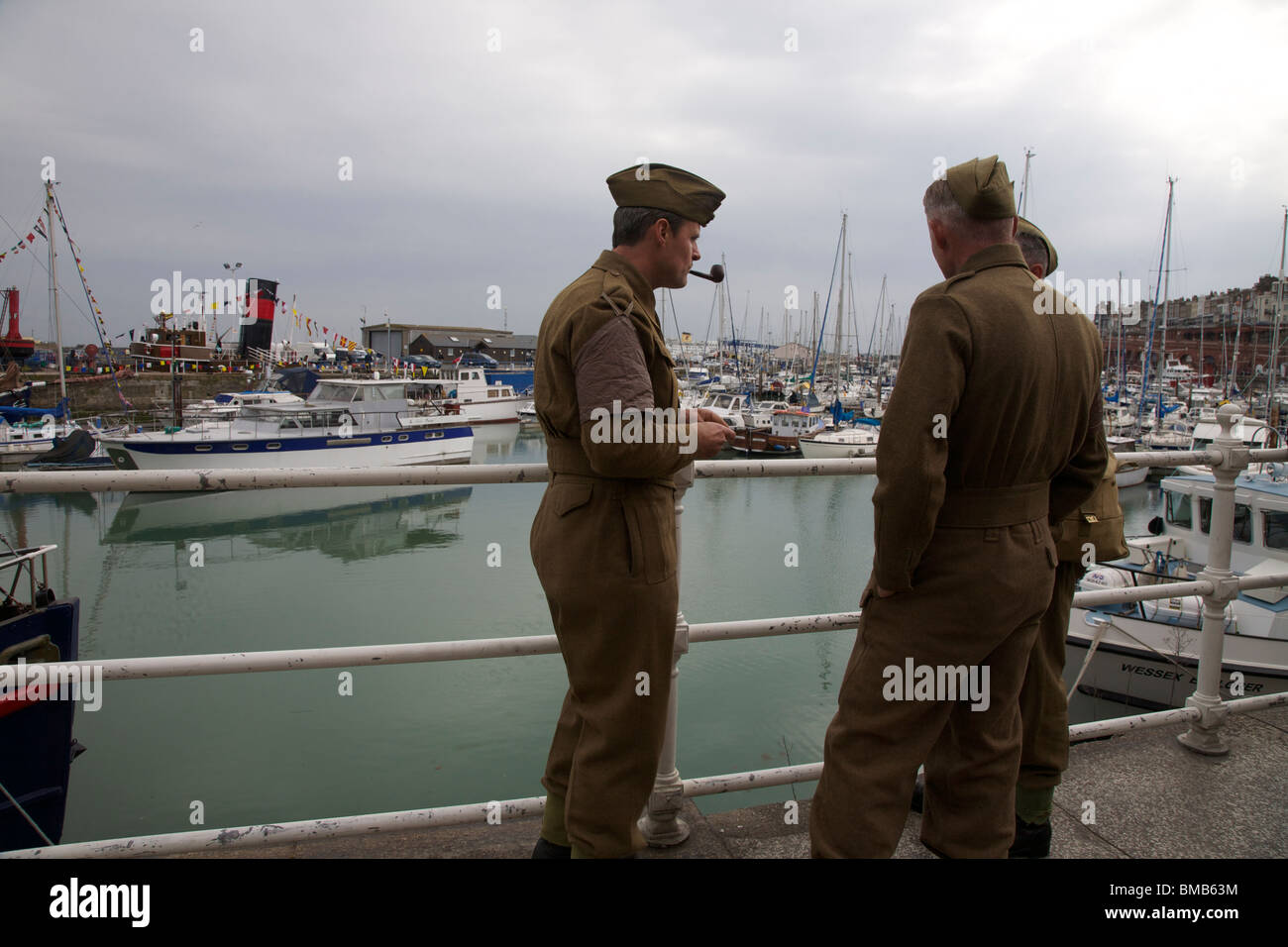 Men dressed in the uniform of Second World War soldiers to commemorate ...