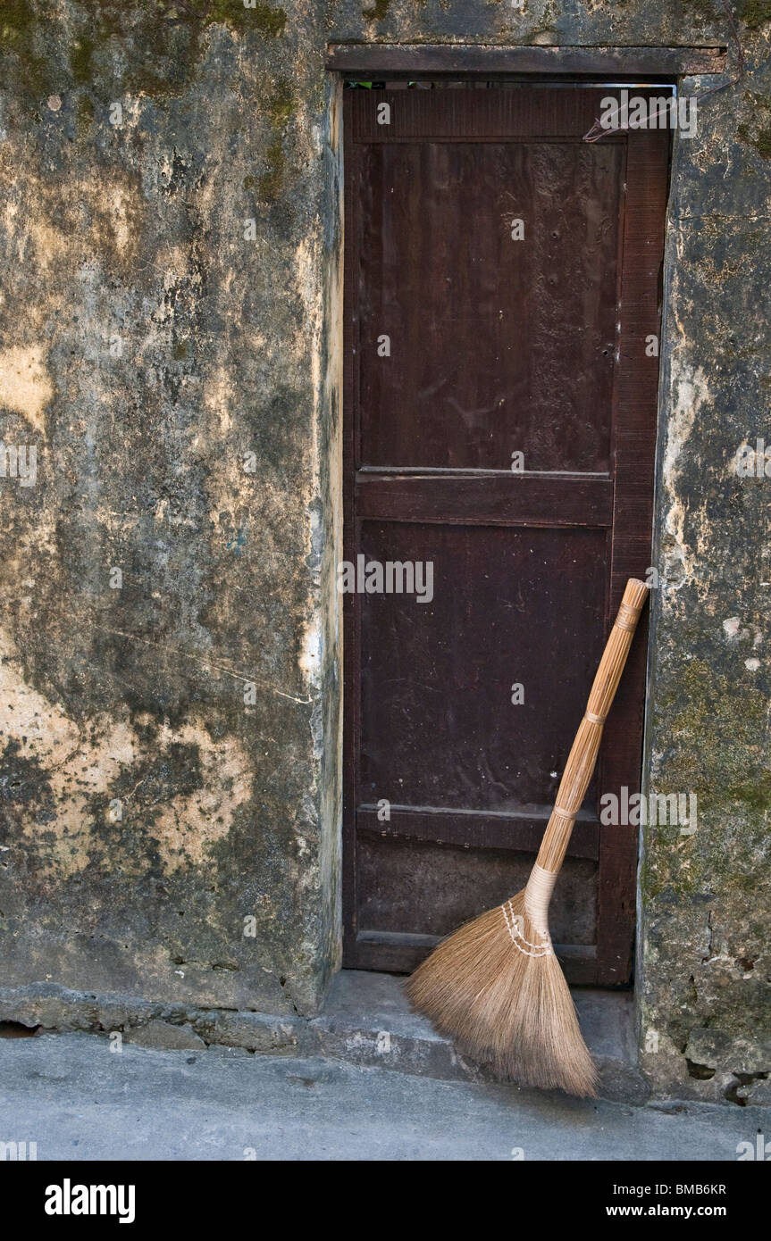 Broom leaning in a doorway, Hoi An, Vietnam Stock Photo - Alamy