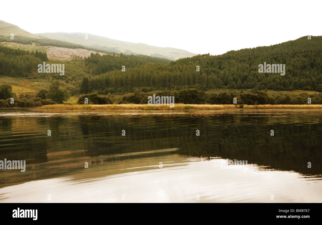 Reflection of hills in loch Stock Photo - Alamy