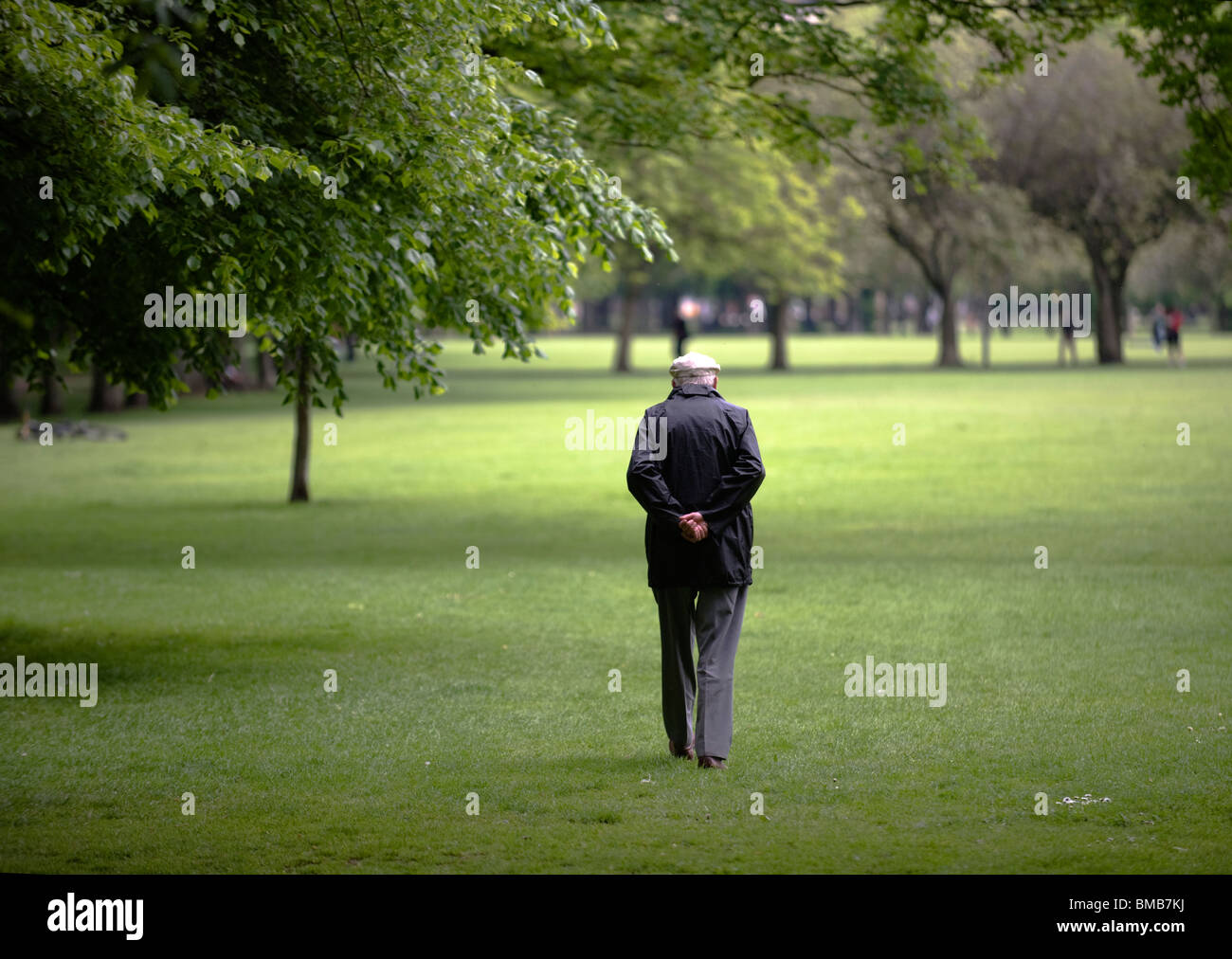 Age, old man walking in woods alone Stock Photo - Alamy
