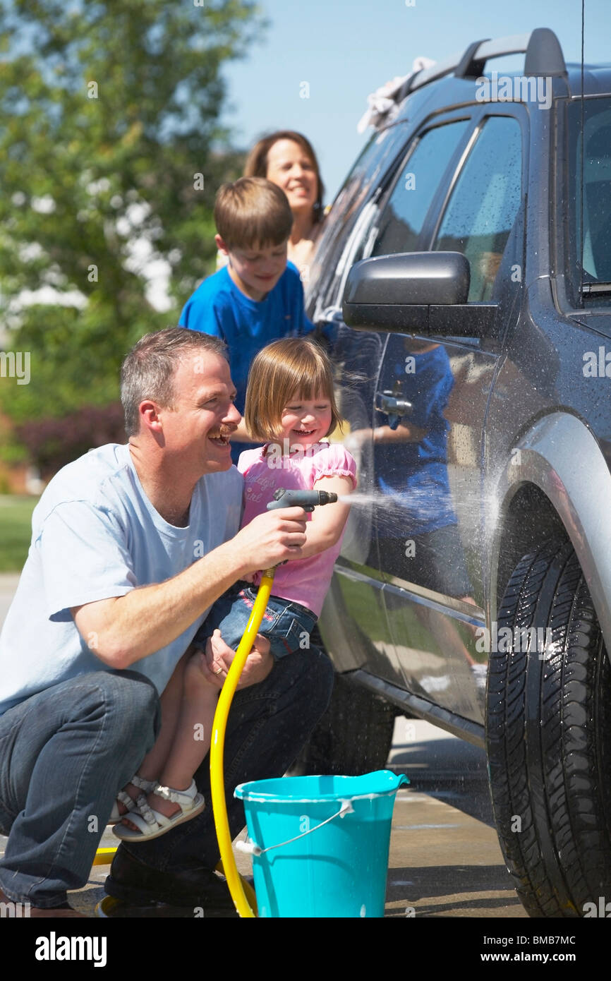 A Family Washing A Vehicle Stock Photo - Alamy