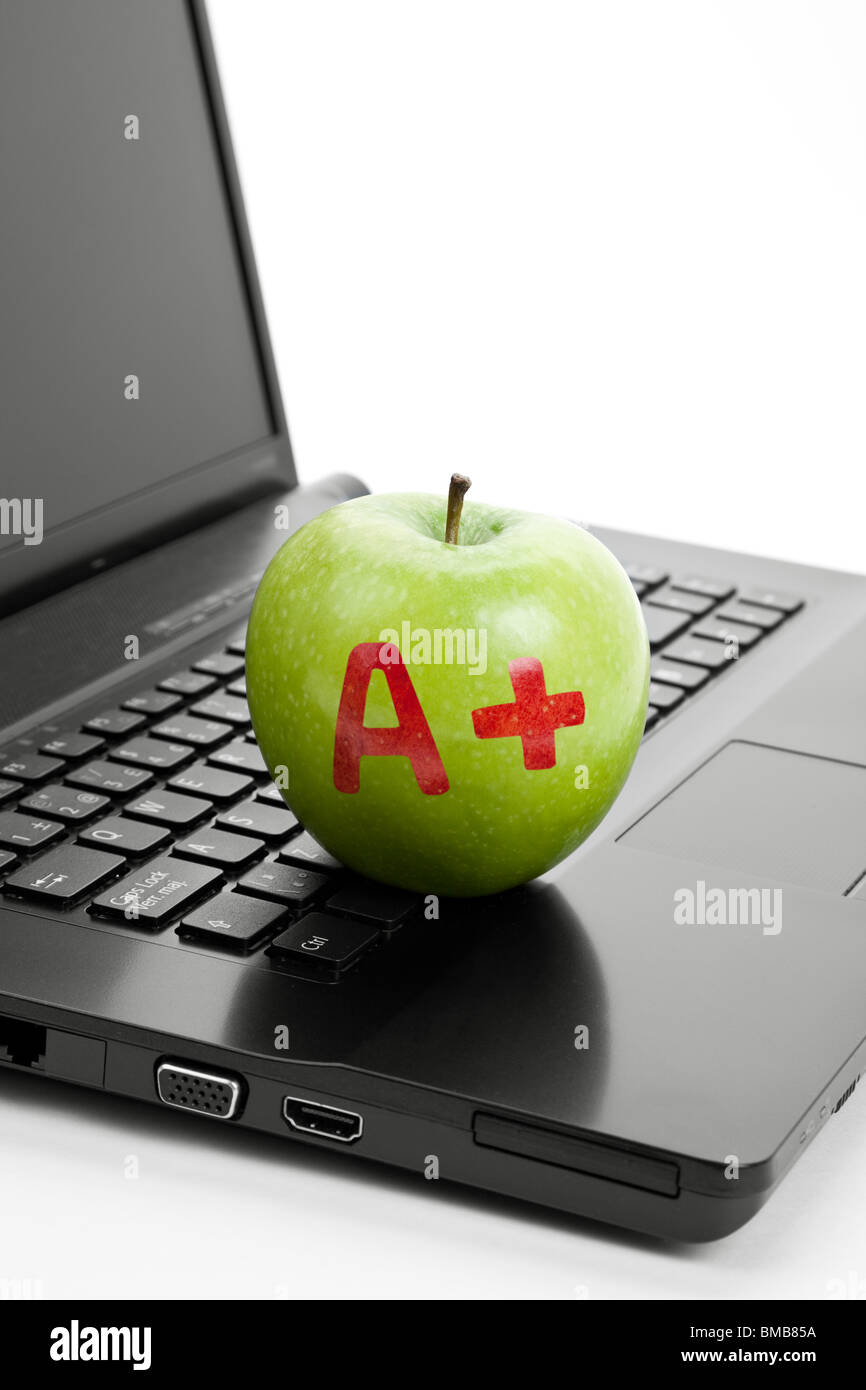 Green apple and laptop close up Stock Photo - Alamy