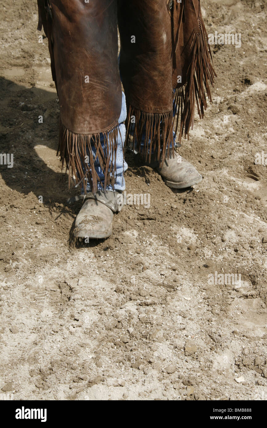 detail of cowboy walking in field Stock Photo - Alamy