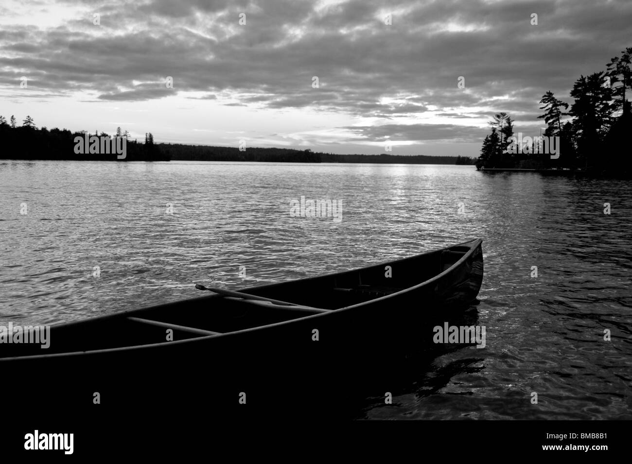 Wooden canoe boat on Black and White Stock Photos & Images - Alamy