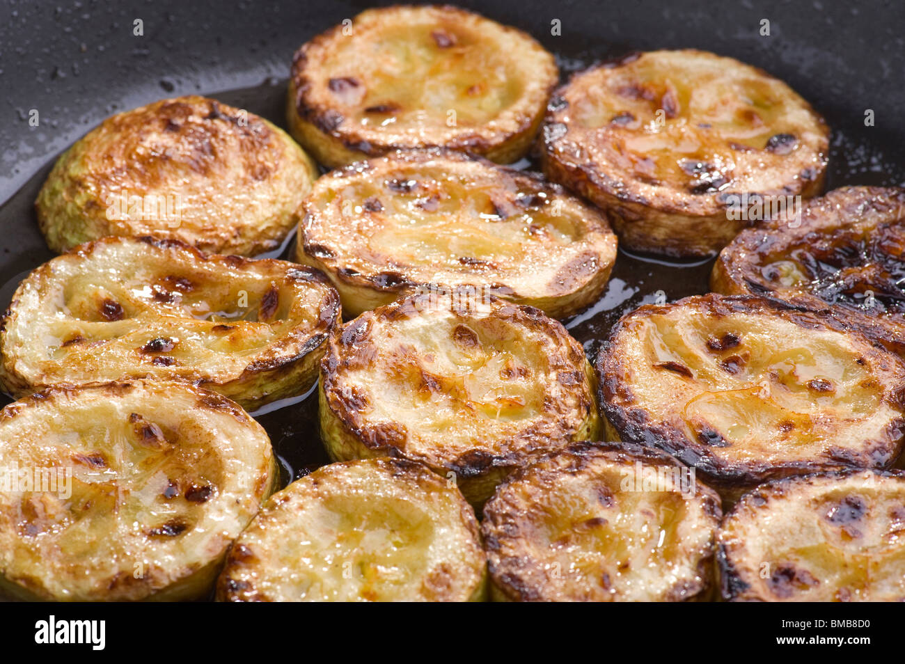 object on black - food fried marrow close up Stock Photo - Alamy