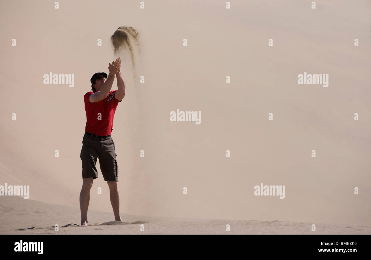 Man male throwing sand dune hi-res stock photography and images - Alamy