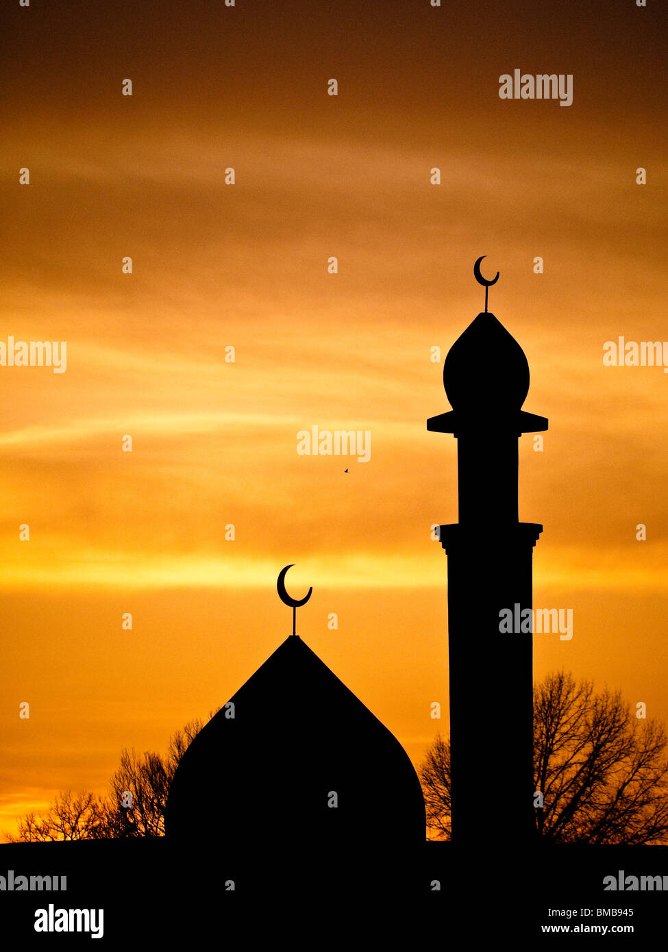 The mosque of the Islamic Center of Central Missouri is silhouetted ...