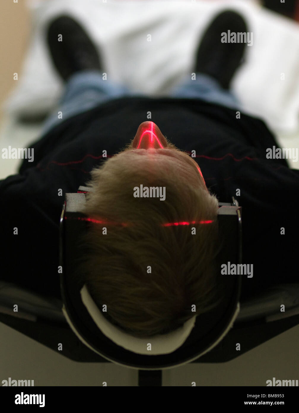 Man being adjusted to the right position before doing a CT (Computer ...