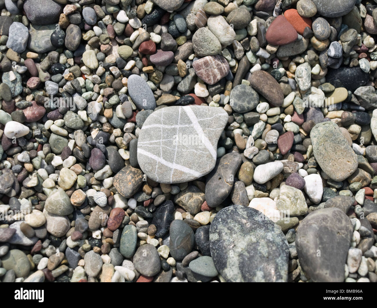 A beach of small colored stones Stock Photo - Alamy