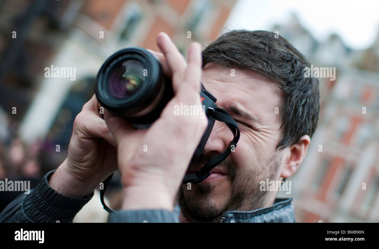 Photographer in action Stock Photo - Alamy