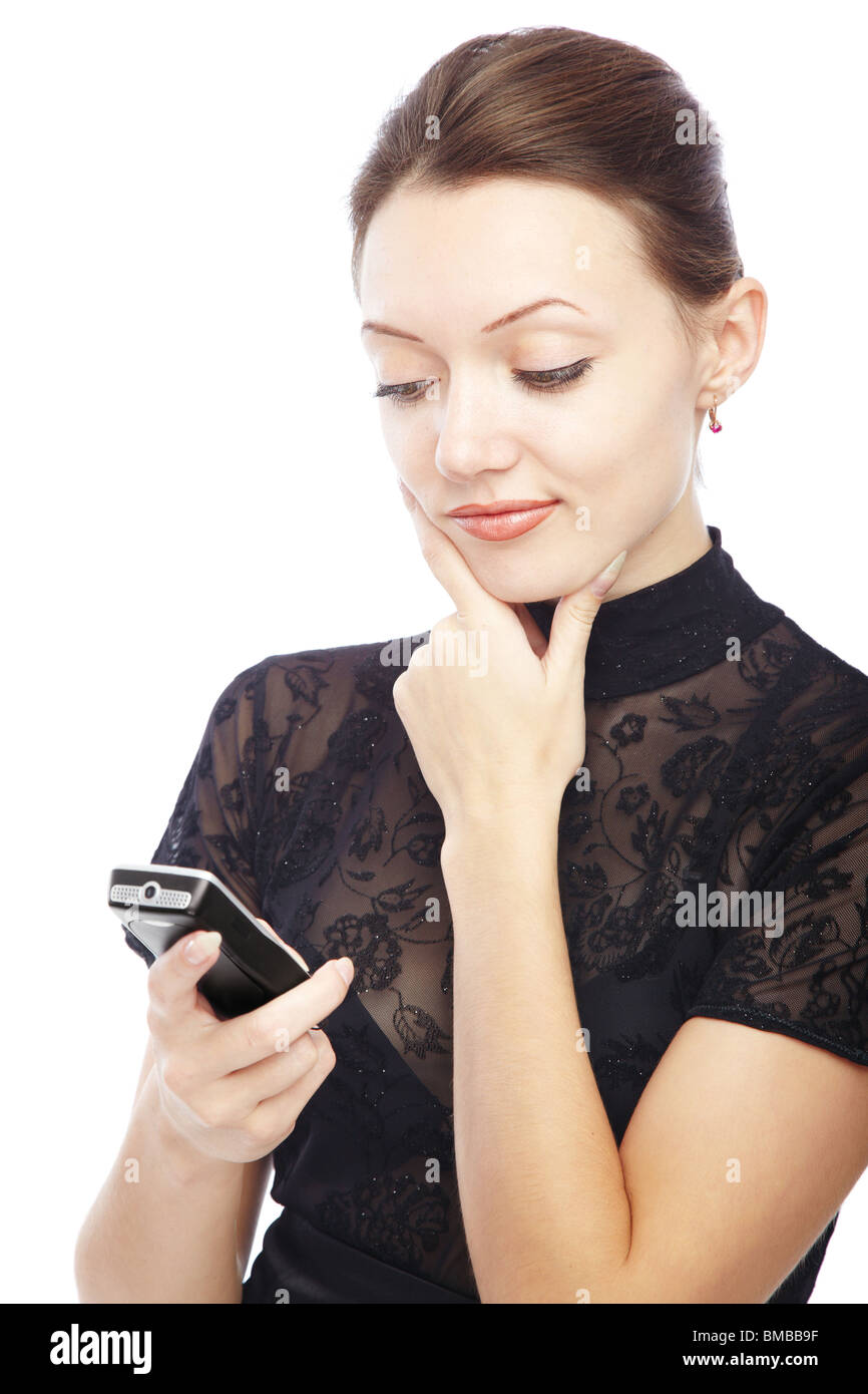 Thinking lady with cellphone reading SMS Stock Photo - Alamy