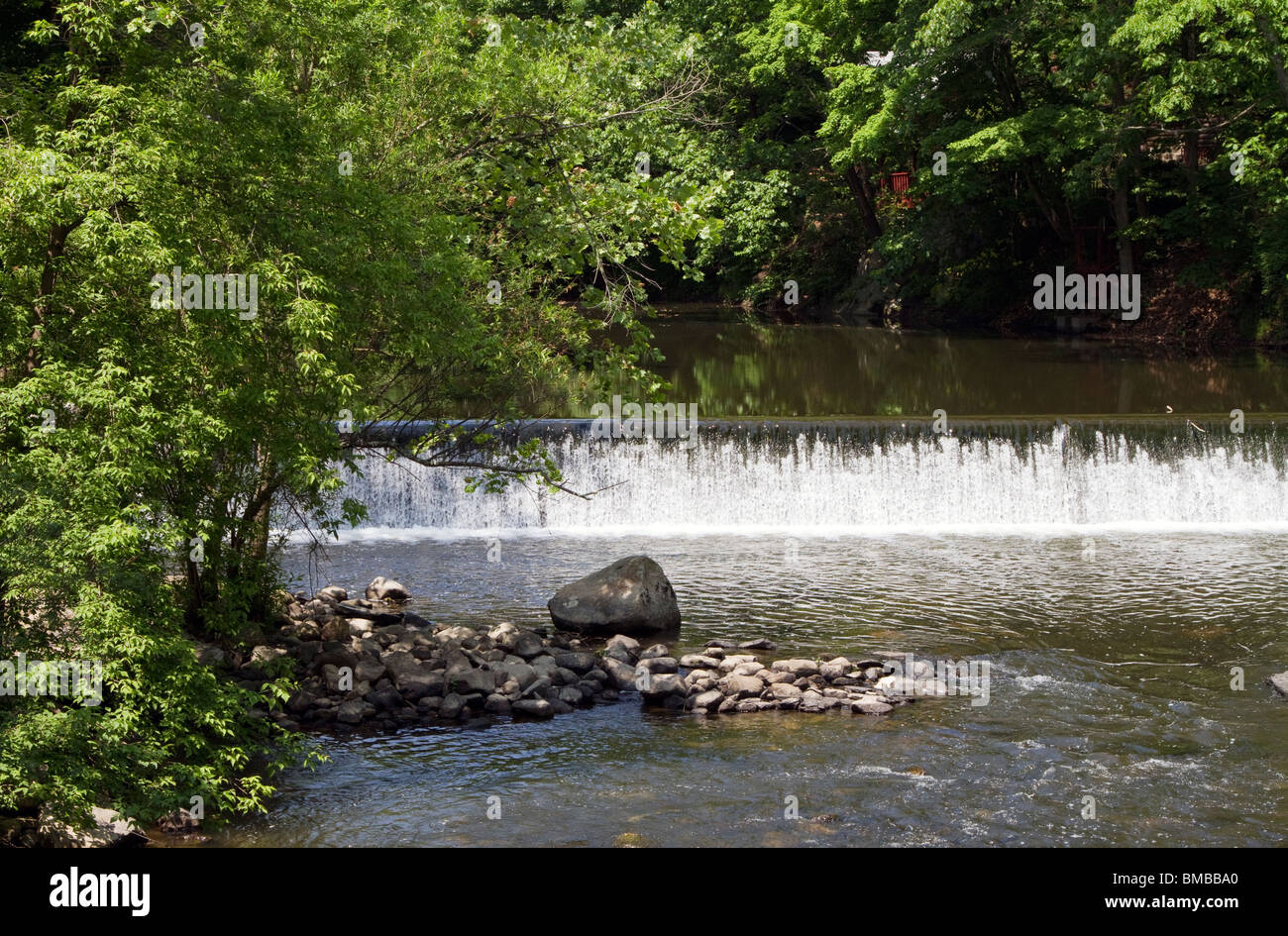 Man made waterfall on a river Stock Photo - Alamy