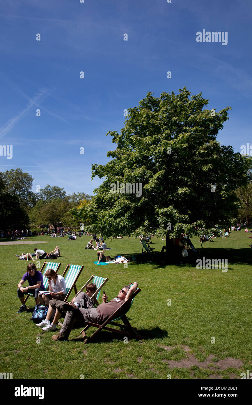People lying on deck chairs hi-res stock photography and images - Alamy