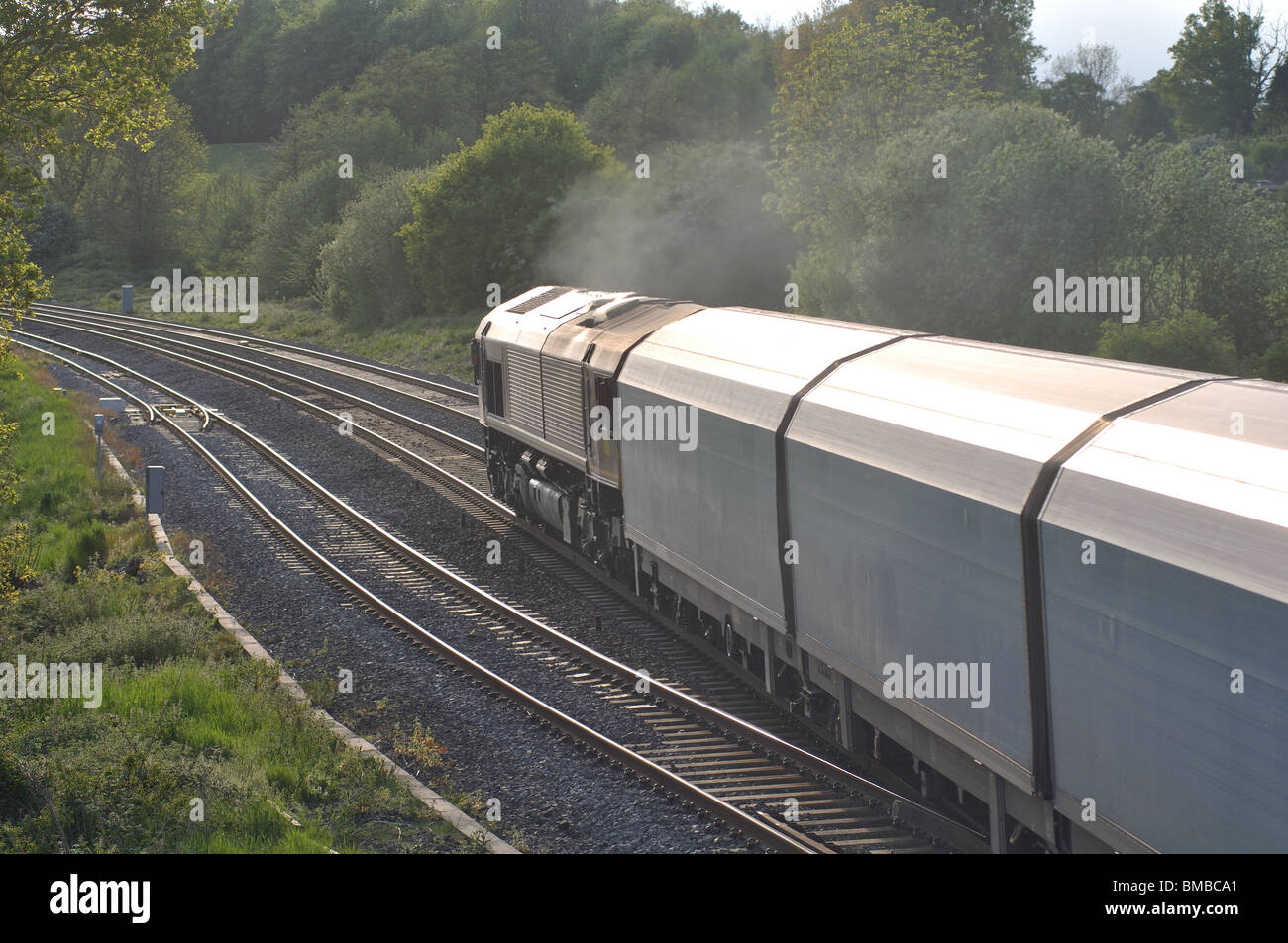 Diesel locomotive pulling covered car transporter wagons, UK Stock ...
