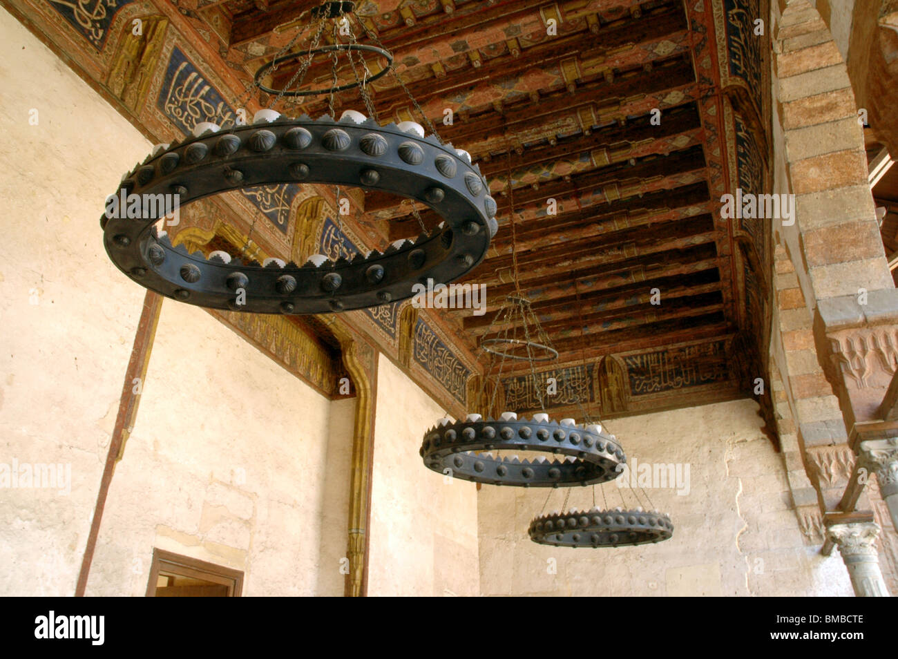 Iron chandeliers and wooden ceiling decorated with Arabic script from ...