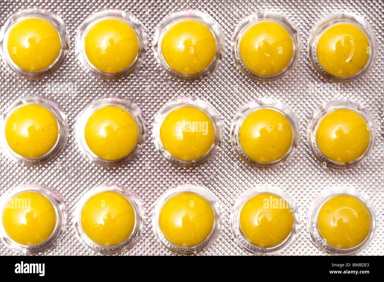 Package of Yellow Pills closeup Stock Photo - Alamy