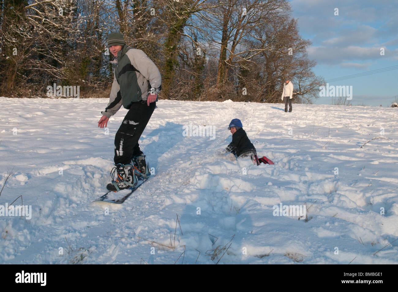 family father on snowboard preschool boy and mother in snow Stock Photo ...
