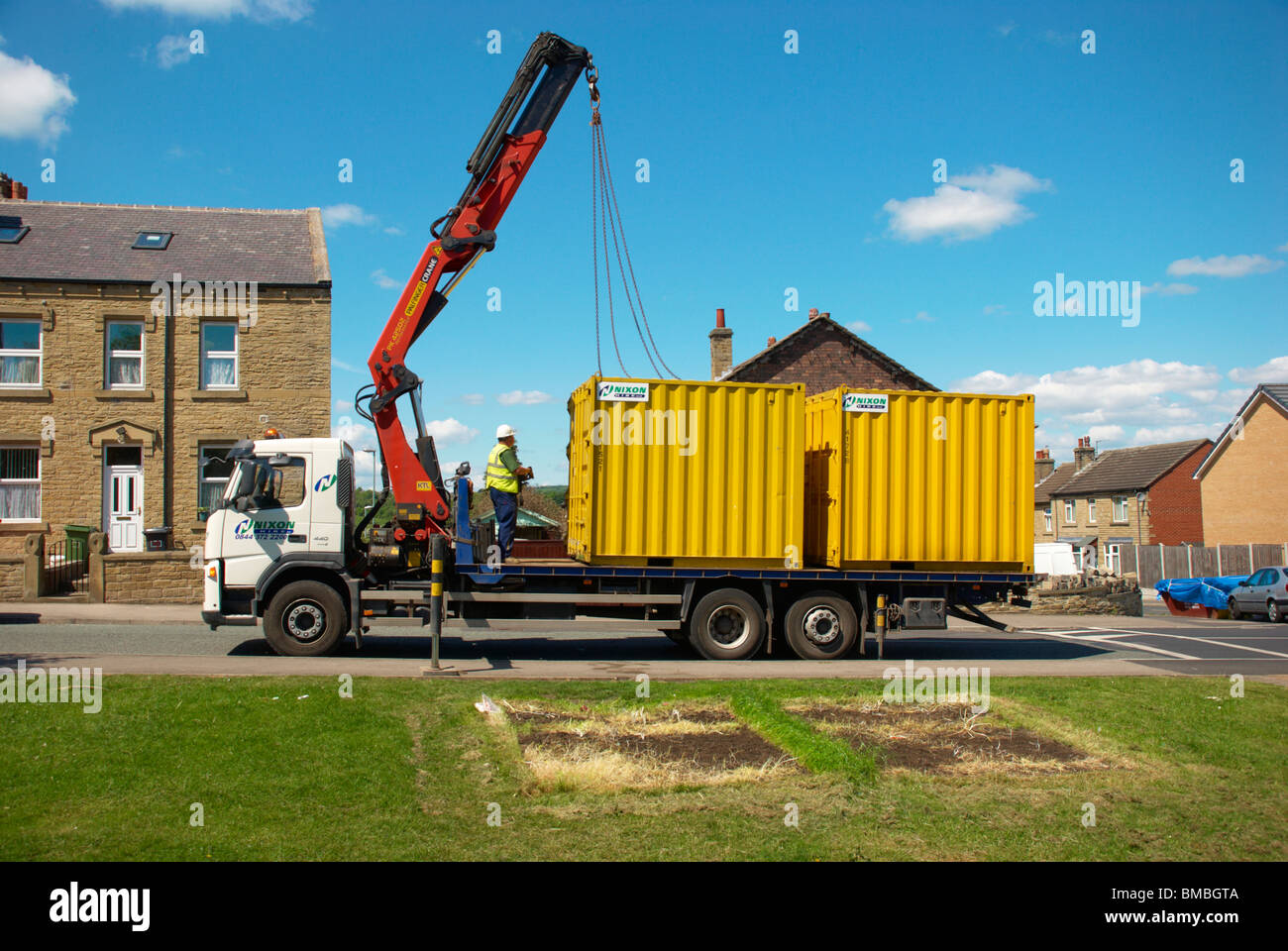 Containers being delivered to a construction site Stock Photo - Alamy