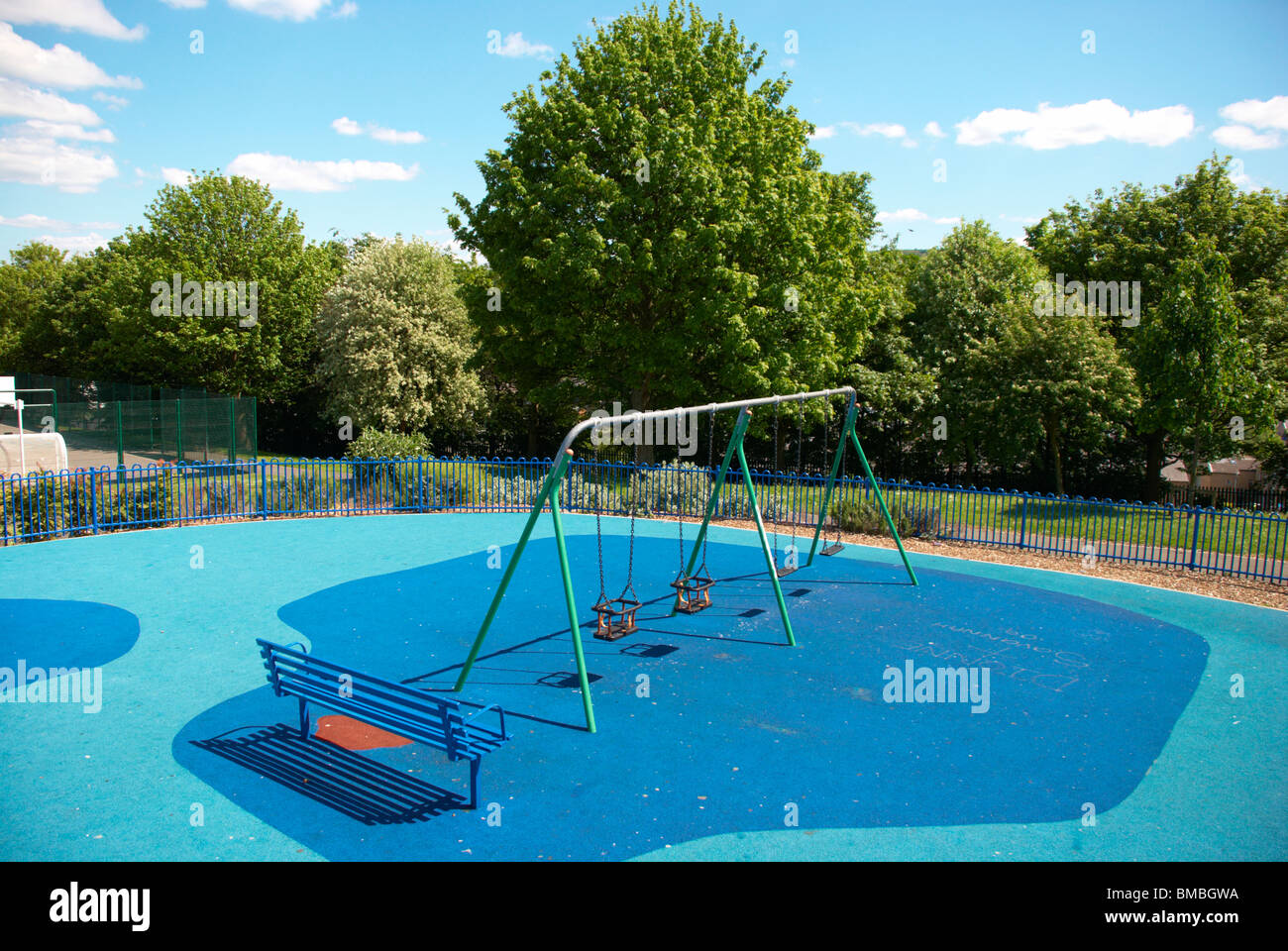 swings at a children's playground Stock Photo - Alamy