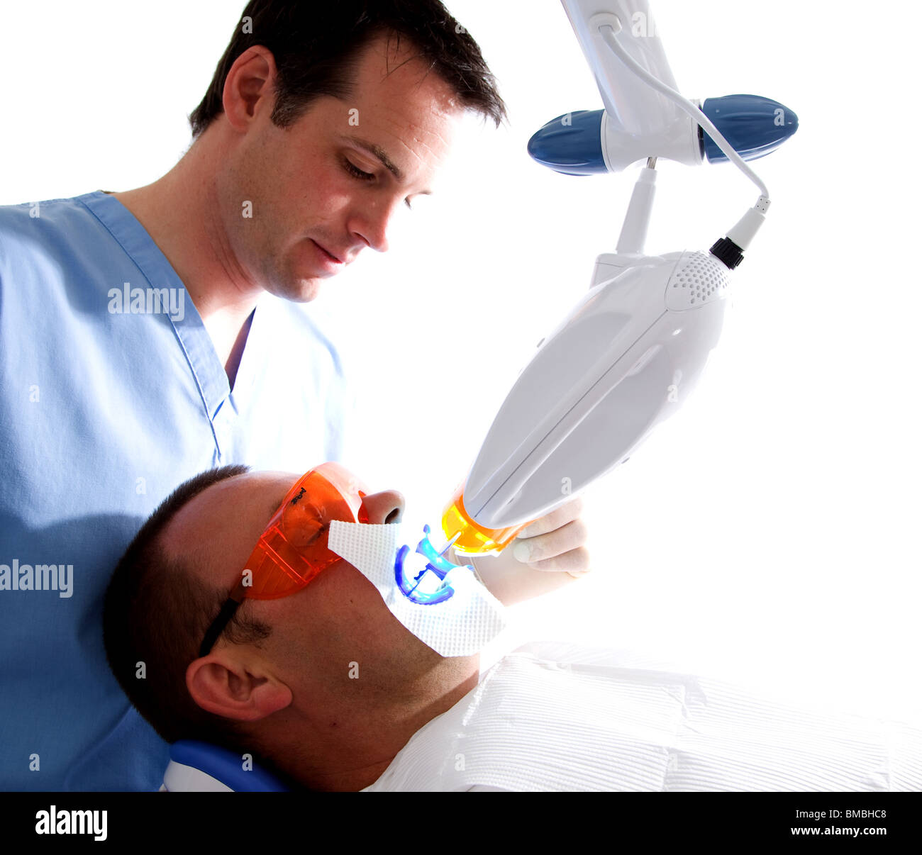 Patient having a tooth whitening procedure Stock Photo - Alamy