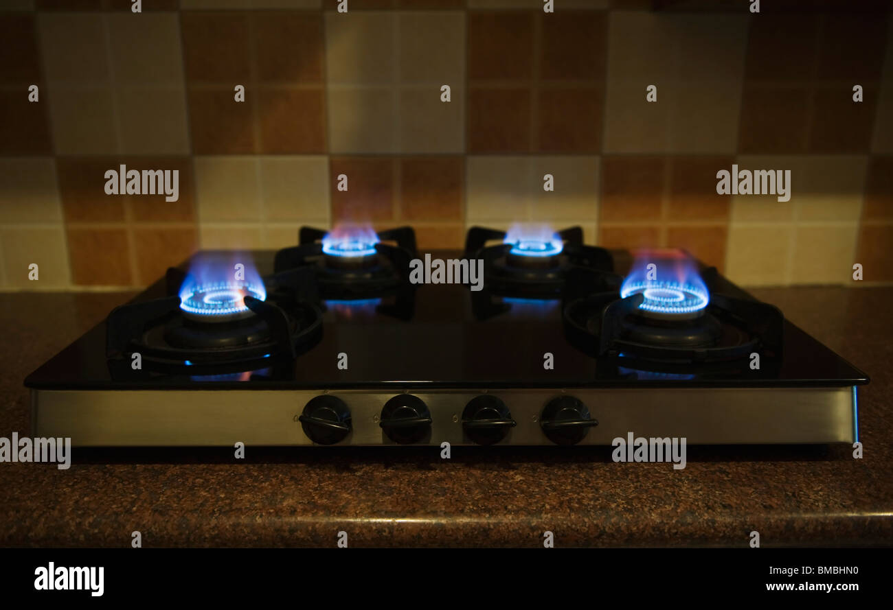 Gas stove on a kitchen counter Stock Photo - Alamy