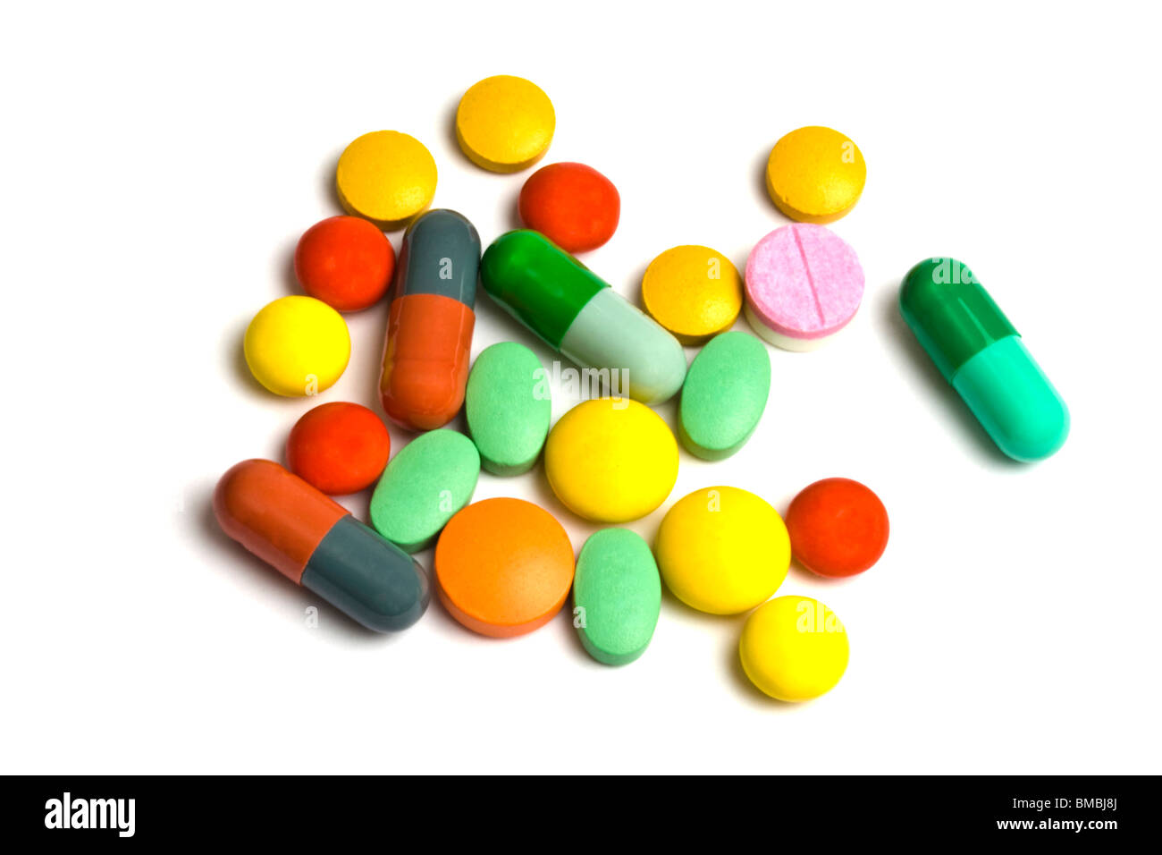 Colorful pills isolated on white background Stock Photo - Alamy