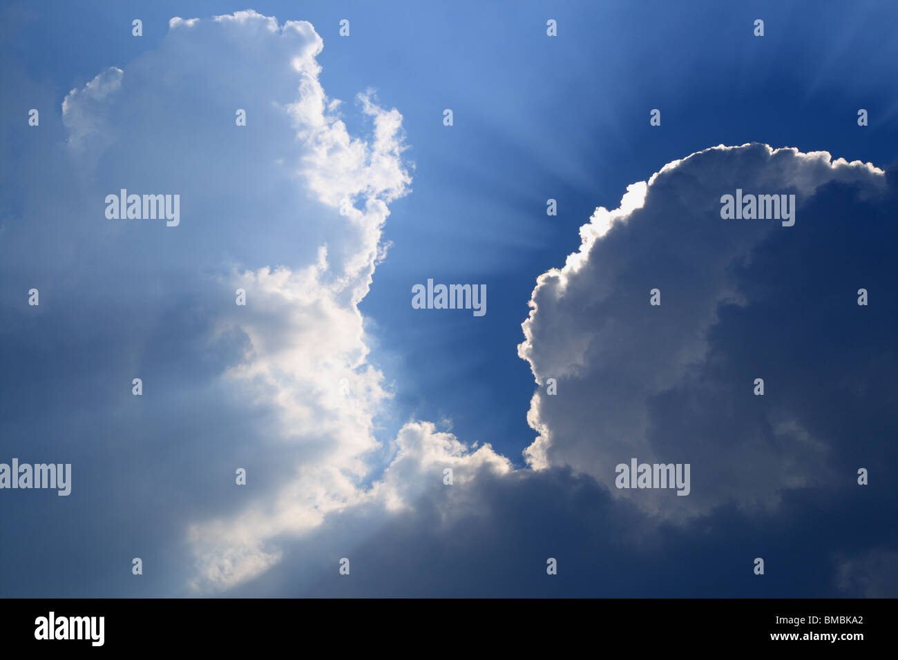 Sun rays from behind clouds Stock Photo - Alamy