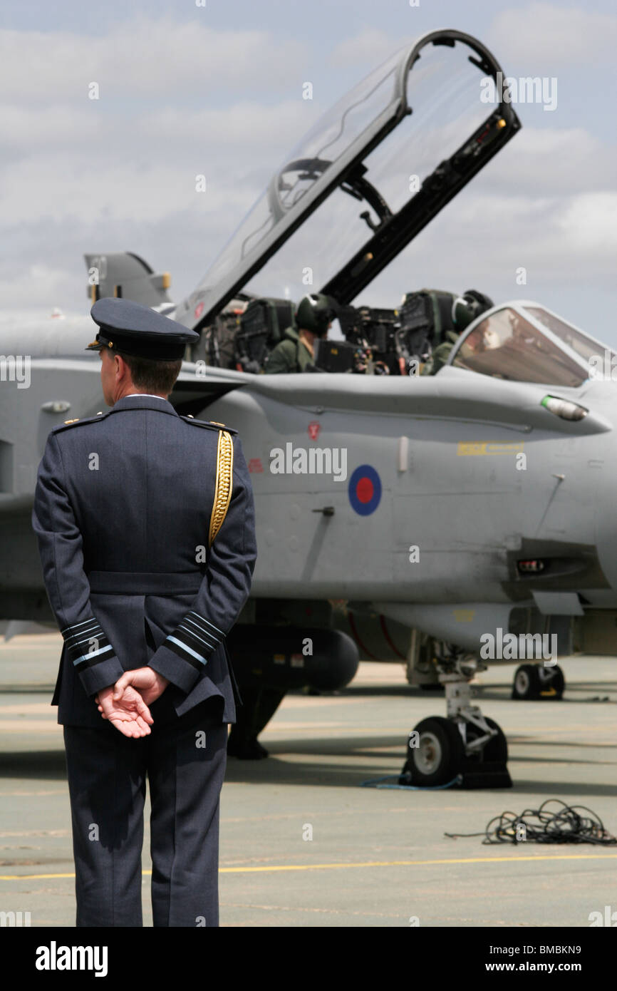 Air Chief Marshal Sir Christopher Moran stands in front of a Tornado ...