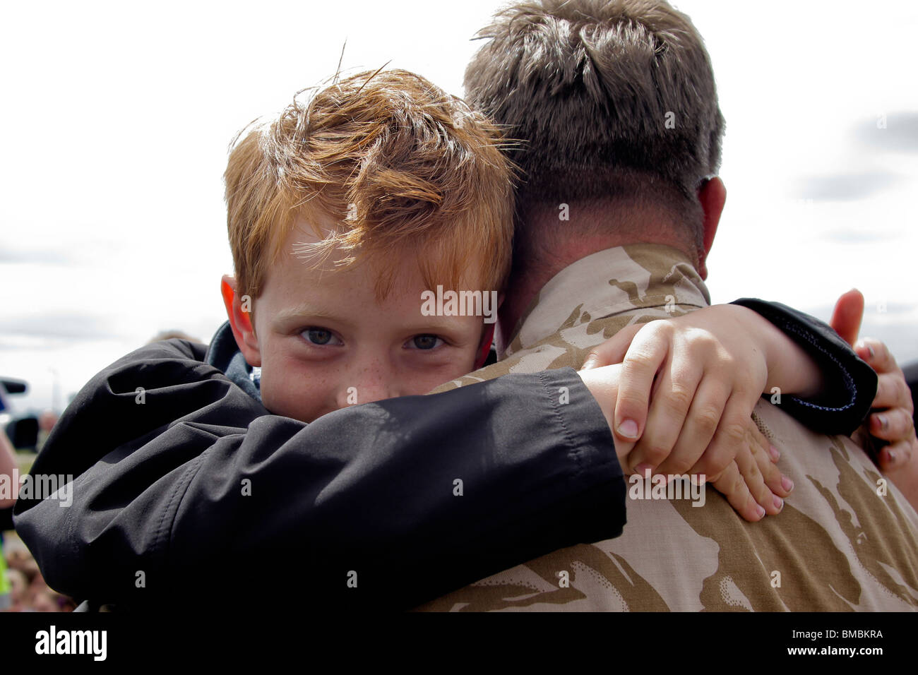 Nathanael Fromage (9) hugs his father, Sgt Nigel Fromage, at a parade ...