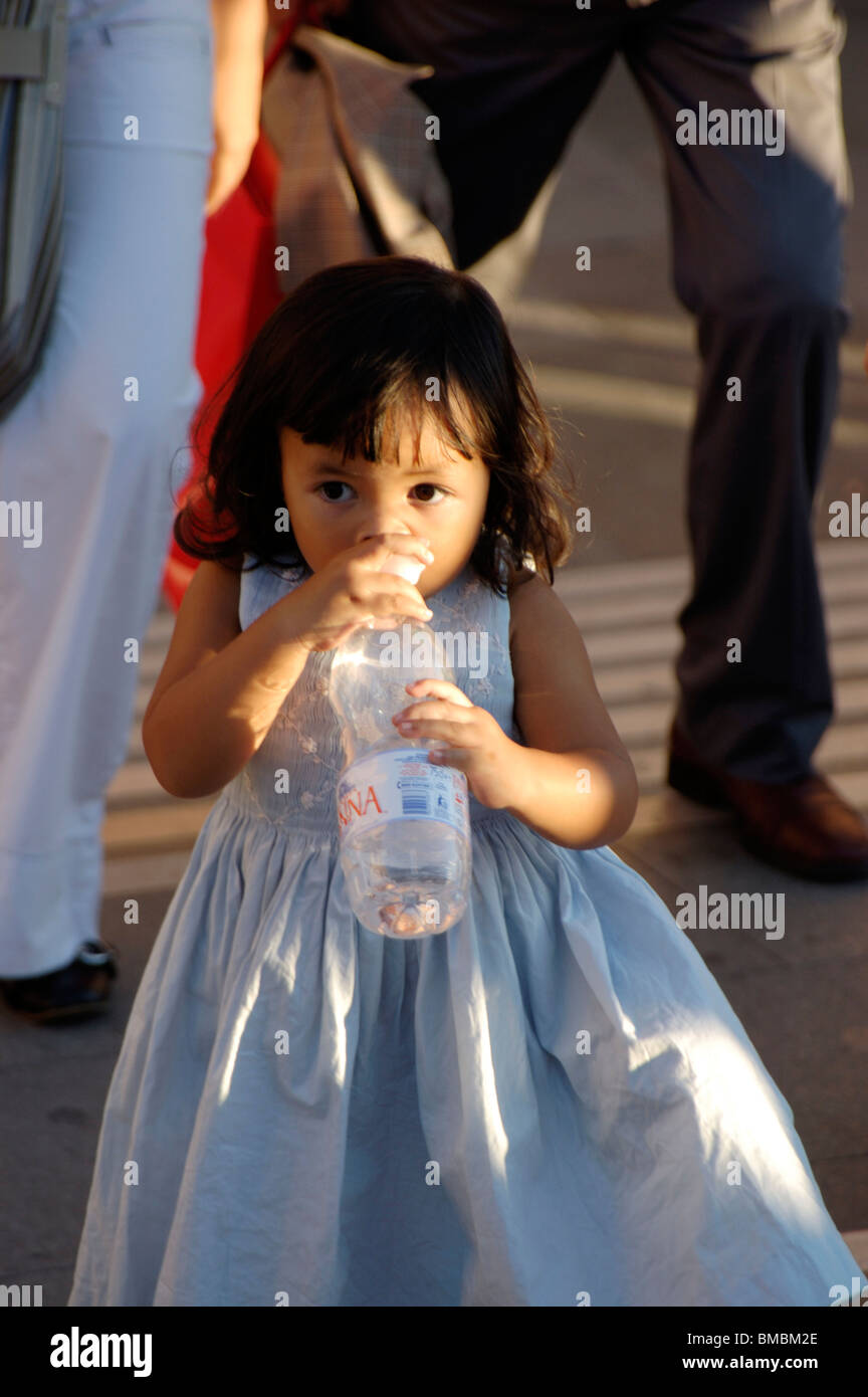 small girl drinking water from a mineral water bottle Stock Photo - Alamy