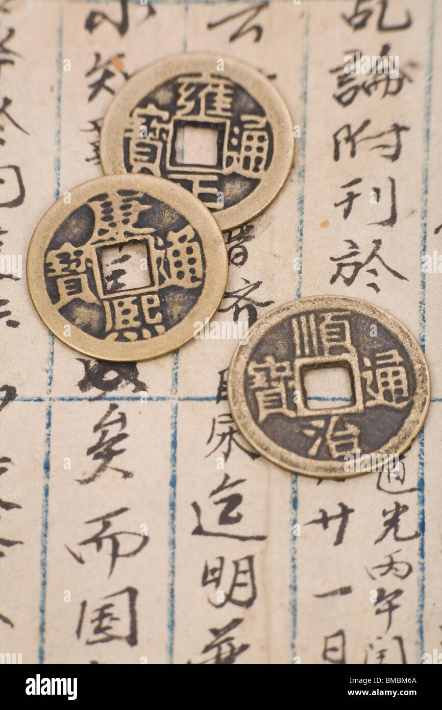 antique chinese book page and coin for background Stock Photo - Alamy