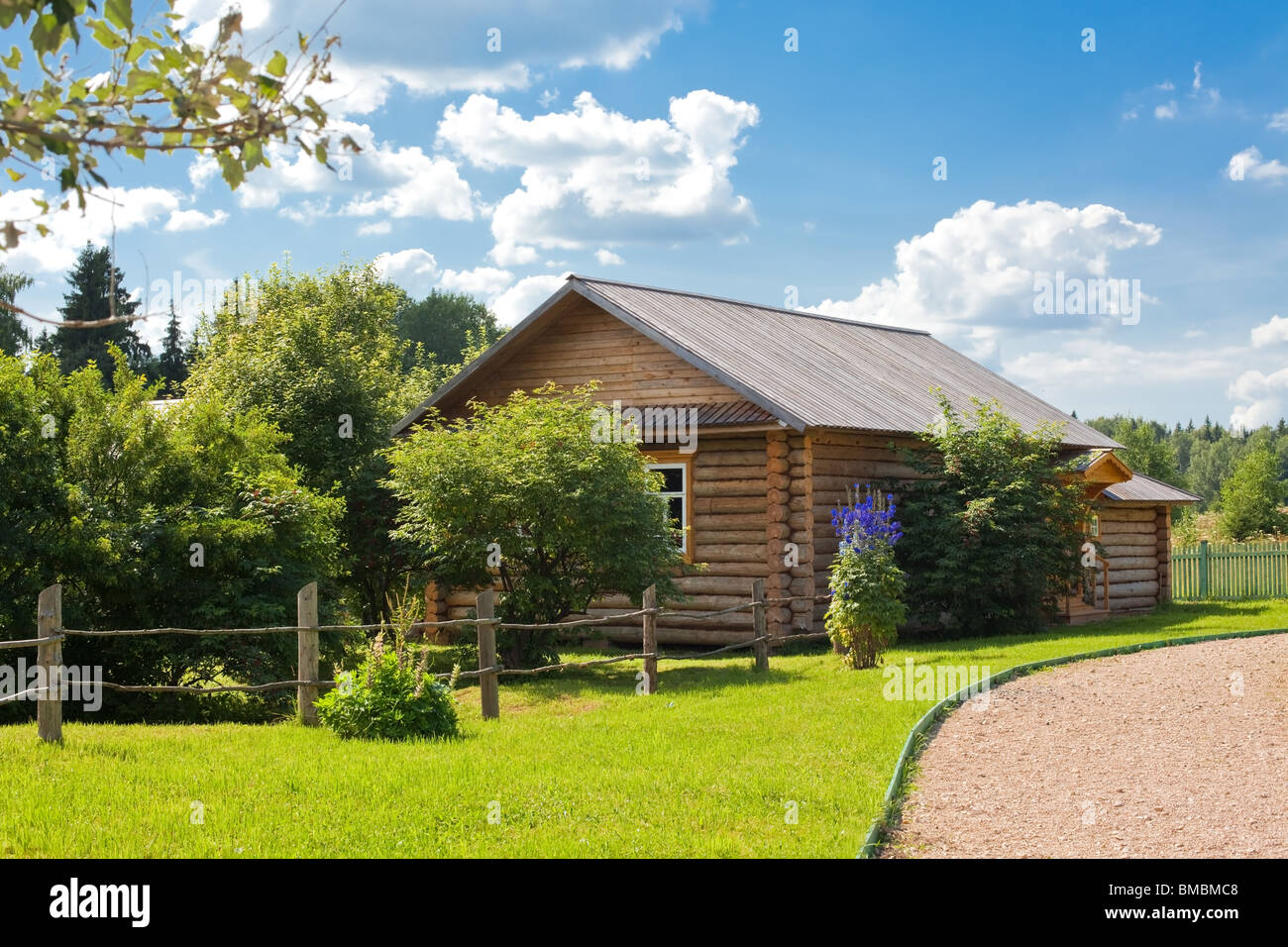 wooden country house with front garden. horizontal shot Stock Photo - Alamy